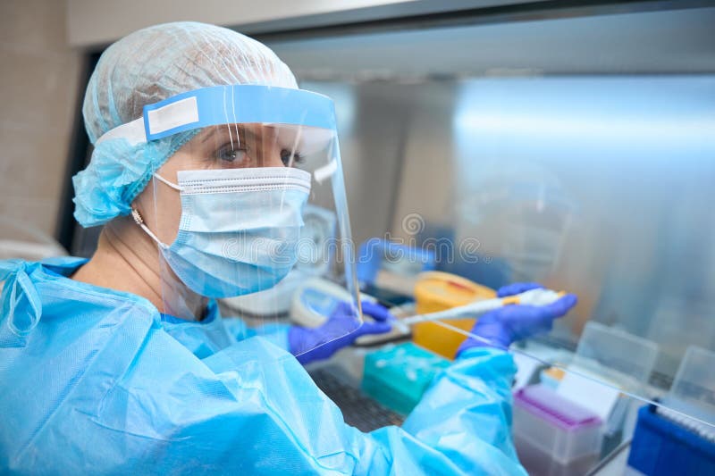 Laboratory Assistant Holds a Laboratory Pipette Dispenser in Her Hands ...
