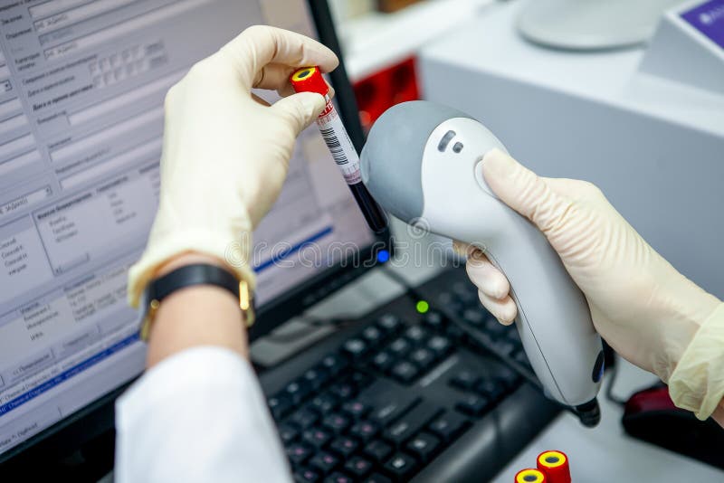 The Laboratory Assistant Holds the Sample in His Hand and Enters the ...