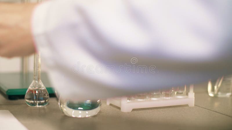 Laboratory Assistant Puts a Stand with Test Tubes on Table Stock ...