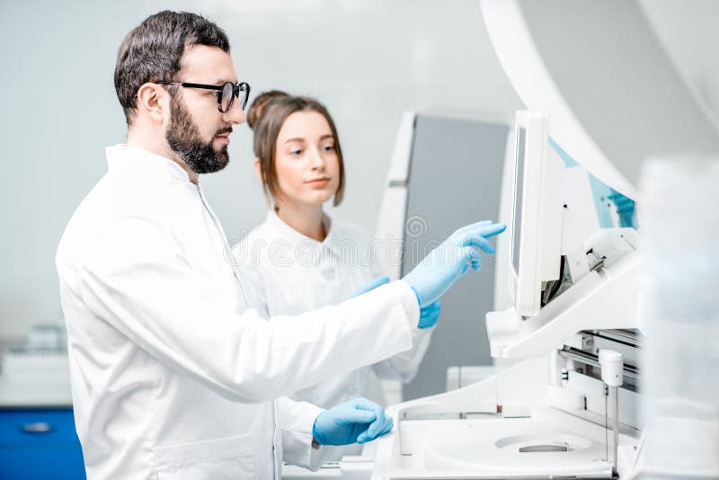 Laboratory Assistants Working with Analizer Stock Photo - Image of ... Laboratory Assistants Working with Analizer Stock Photo - Image of ...