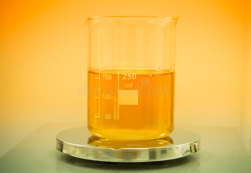 Beaker with Orange Liquid stock image. Image of scientific - 5463291