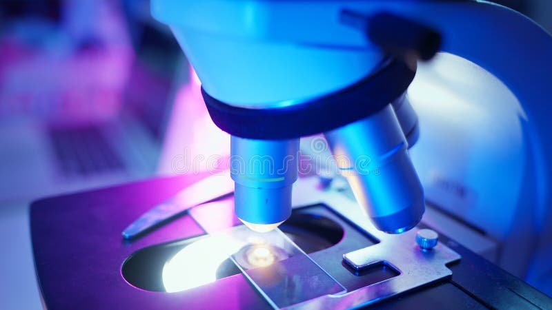 Laboratory Chemist Analyzing Samples with Advanced Technology in Neon ...