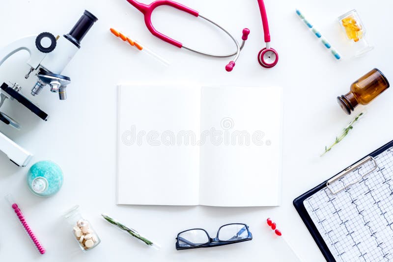 Laboratory Desk with Notebook, Stethoscope, Test Tube and Microscope on ...