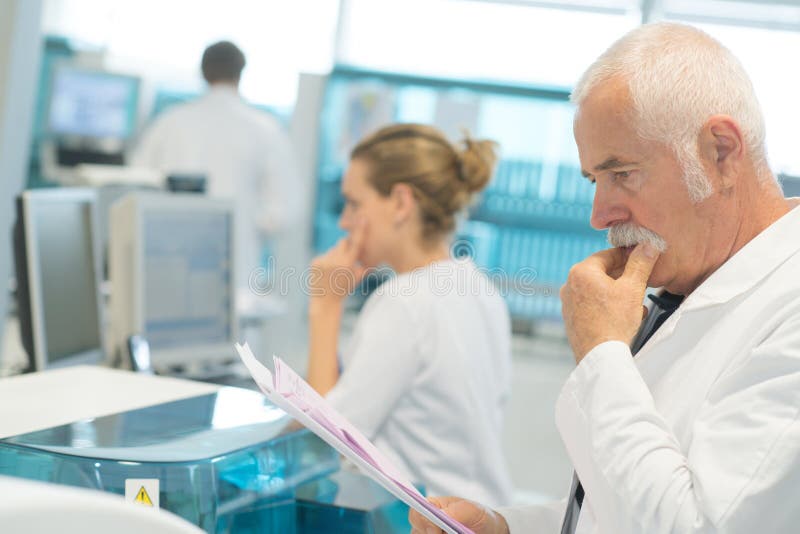 Laboratory Doctor Reading Information Stock Photo - Image of doctor ...