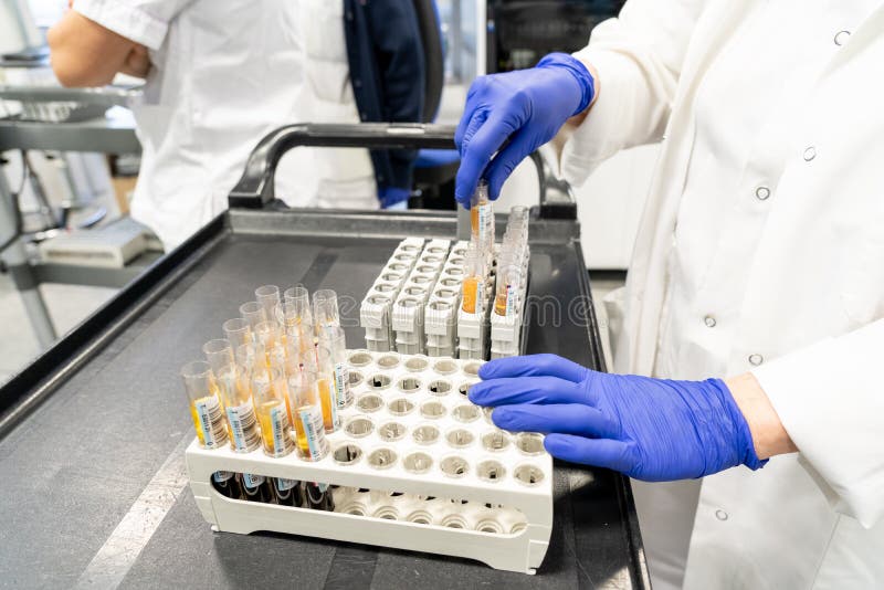 Woman in Laboratory Doing Tests for Vaccine Blood Extraction and ...
