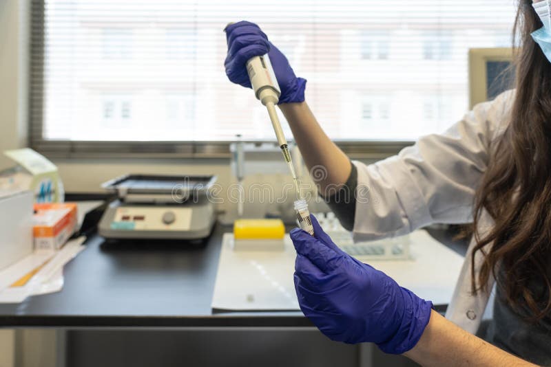 Woman in Laboratory Doing Tests for Vaccine Blood Extraction and ...