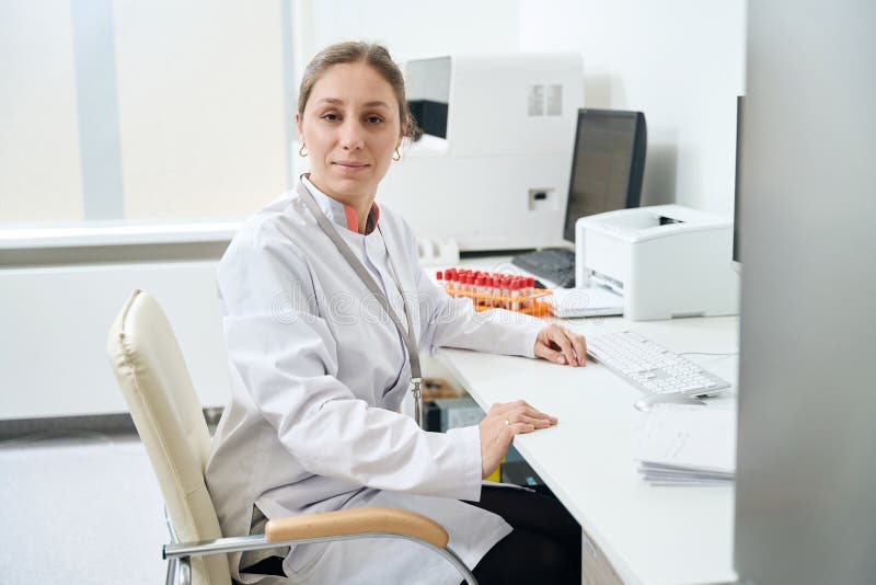 Laboratory Employee is Sitting at Her Desk Stock Photo - Image of ...
