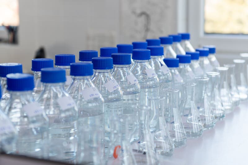 Laboratory Equipment. Laboratory Storage Bottles with Blue ...