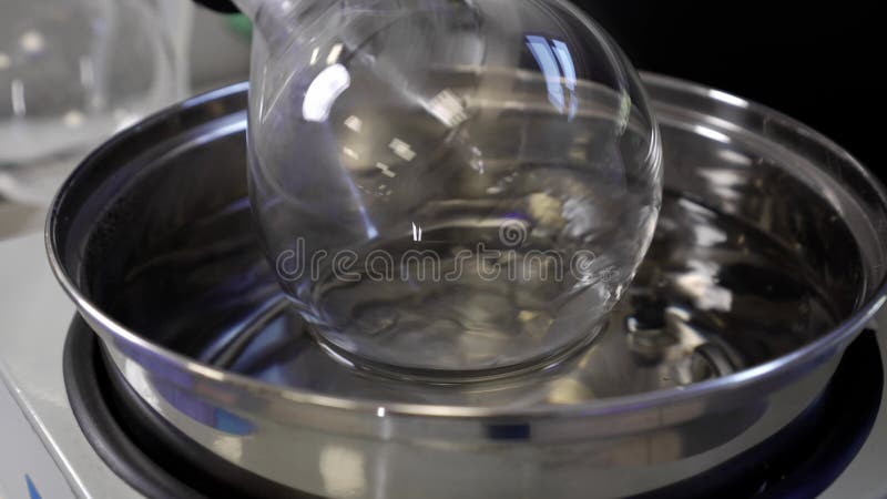 Laboratory Flask in Water Bath for Sample Testing Stock Video - Video ...