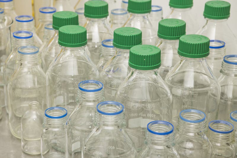 Laboratory Glass Flasks with Green Caps. Science Laboratory. Glassware ...