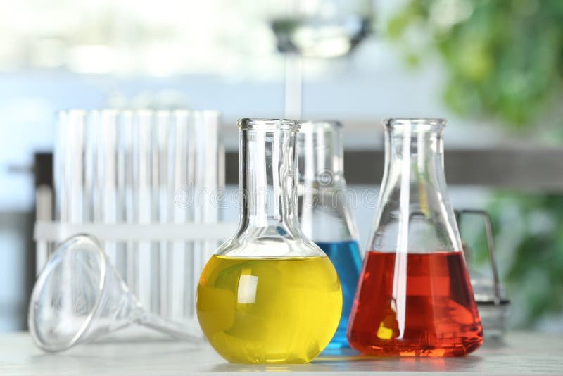 Laboratory Glassware with Different Liquid Samples Stock Photo - Image ...