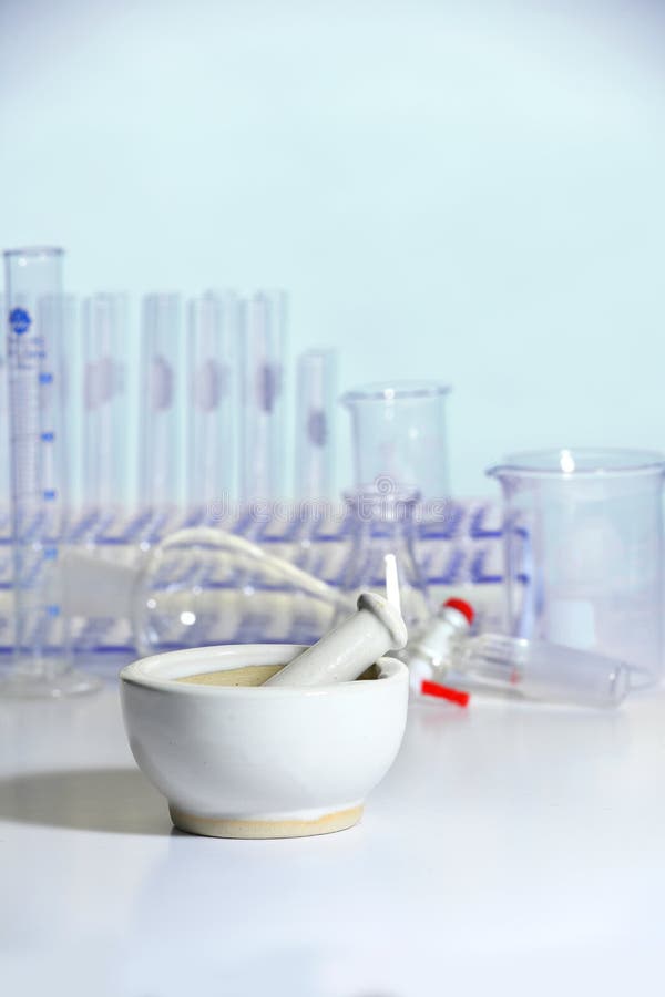 Laboratory Glassware with Mortar Stock Photo - Image of science ...