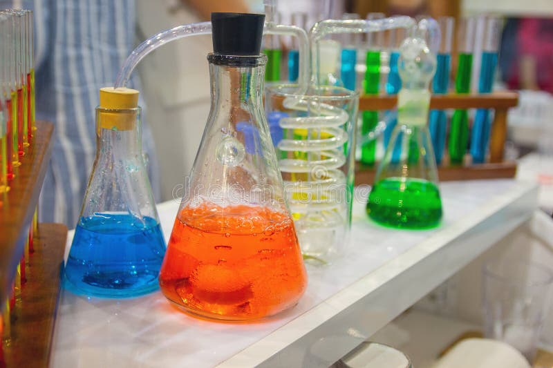 Laboratory Glassware with Solutions of Different Colors on Table Stock ...