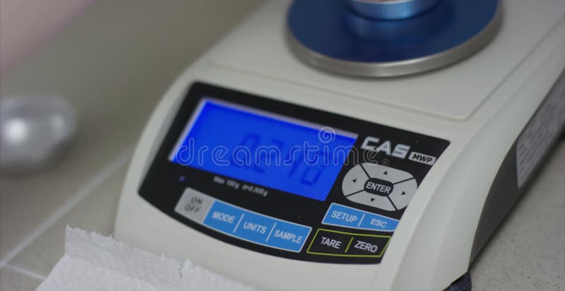 Laboratory High Precision Weighing Scale. Young Engineer Using Vernier ...