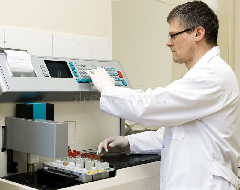 Laboratory man and machine stock photo. Image of detail - 2335412