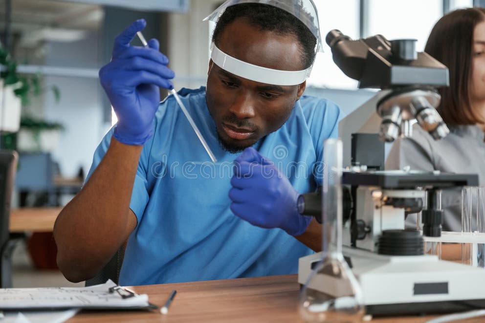 Laboratory with Microscope. Group of Doctors are Together Indoors Stock ...