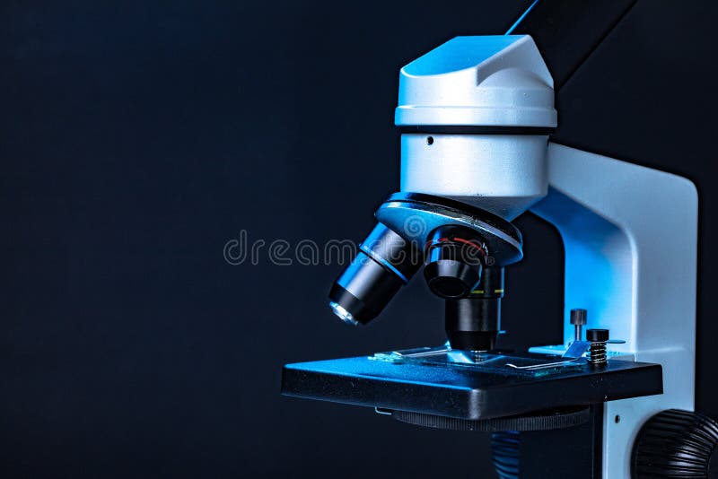 Microscope with Lenses Close Up Against Dark Background Stock Photo ...