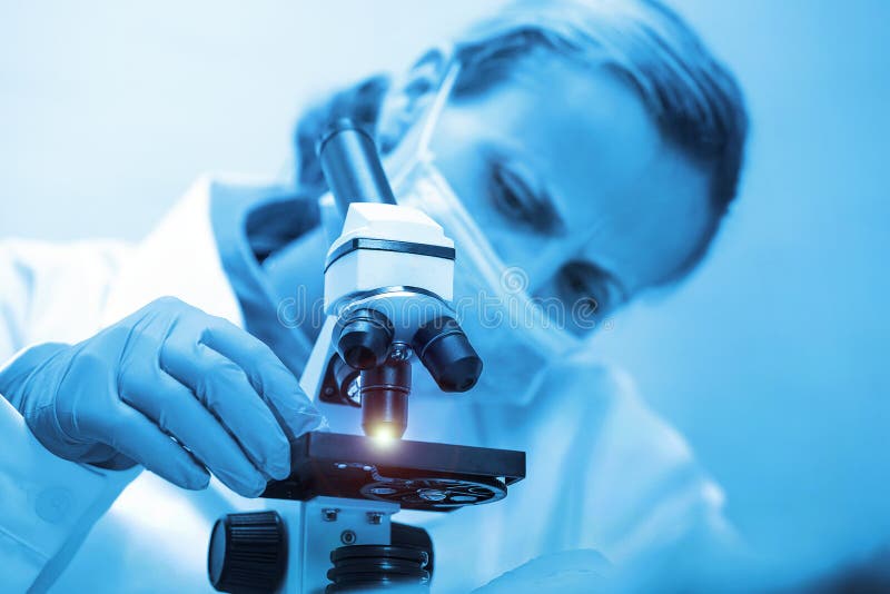 Laboratory Microscope. Scientist Using a Microscope in a Laboratory ...