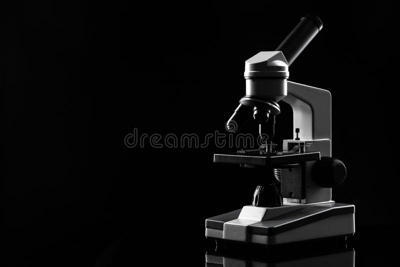 Laboratory Microscope on Table in the Dark Stock Photo - Image of ...