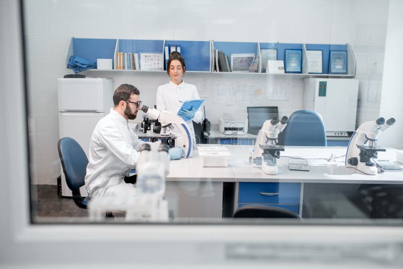 Laboratory Office with Medics and Microscopes Stock Photo - Image of ...