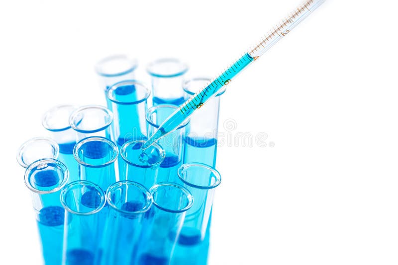Laboratory Pipette with Drop of Blue Liquid Over Test Tubes for an ...