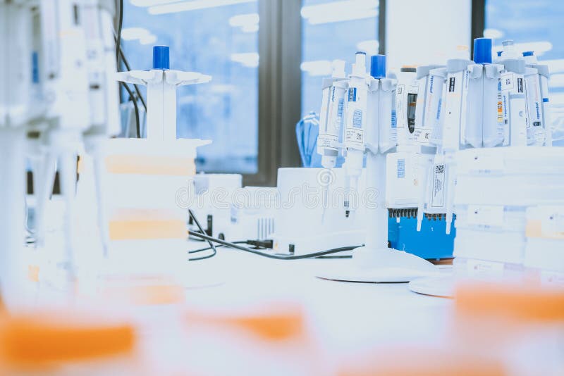 Laboratory Pipettes on Blurred Laboratory Background. Research and ...