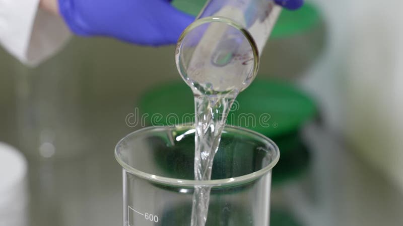 The Laboratory Process Involves Precise Liquid Pouring into a Beaker ...