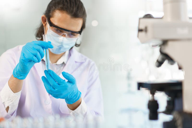 Laboratory Research Concept, Scientist Analyzing Sample in Test Tube To ...