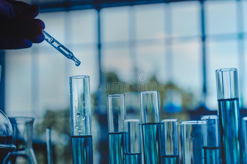 Laboratory Research, Dropping Liquid To Test Tubes. Stock Photo - Image ...