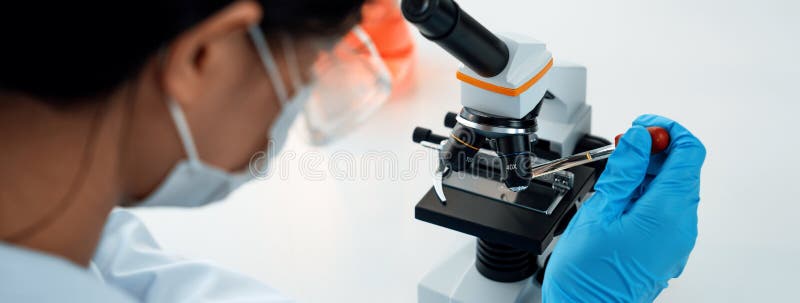 Laboratory Researcher Develop New Medicine or Cure Using Microscope ...
