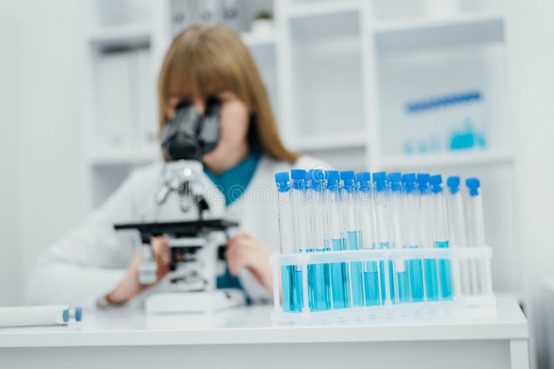 A Laboratory Scene Featuring a Scientist Observing Samples through a ...