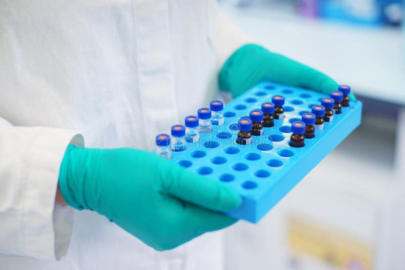 Laboratory Scientist Holds a Plastic Box with Samples of Transparent ...