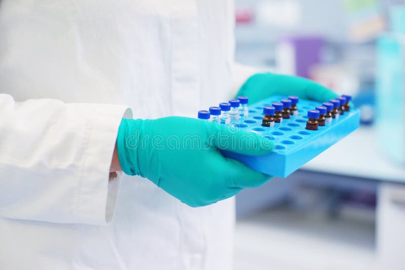 Laboratory Scientist Holds a Plastic Box with Samples of Transparent ...
