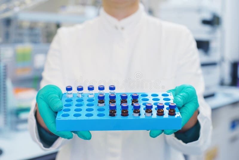 Laboratory Scientist Holds a Plastic Box with Samples of Transparent ...