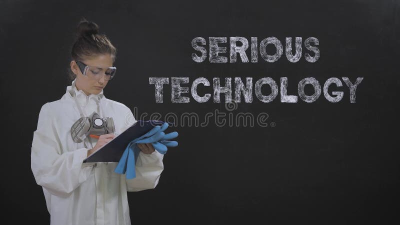 A Laboratory Scientist in Protective Gear Holding a Clipboard for Data ...