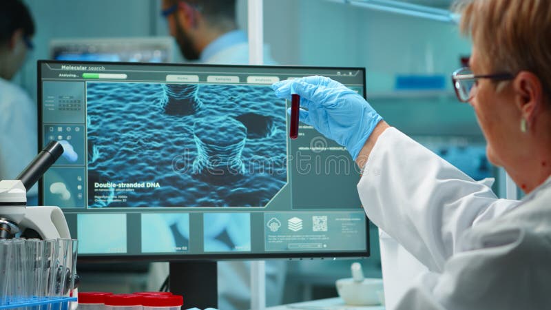 Laboratory Scientist Working with Blood Test Late at Night Stock Photo ...