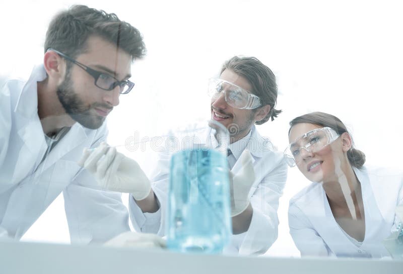 Group of Scientists Working on an Experiment at the Laboratory Stock ...