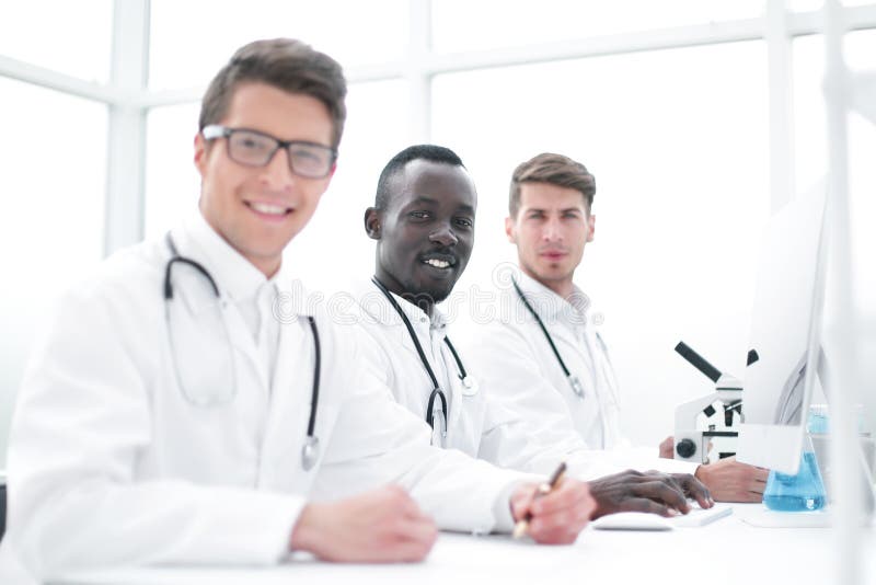 Laboratory Staff Sitting at the Desk Stock Photo - Image of hospital ...