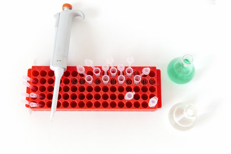 Laboratory Table with Flask, Digital Pipette and Small Plastic Test ...