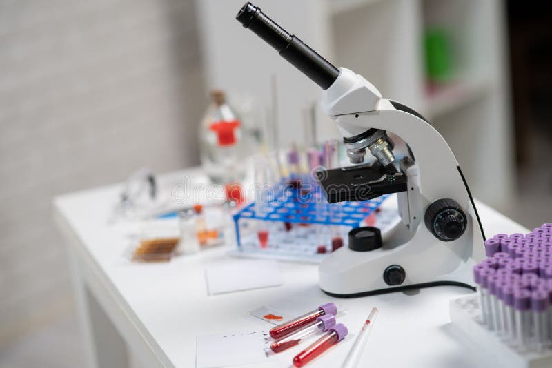 Microscope with Test Tubes on a Laboratory Bench Stock Photo - Image of ...