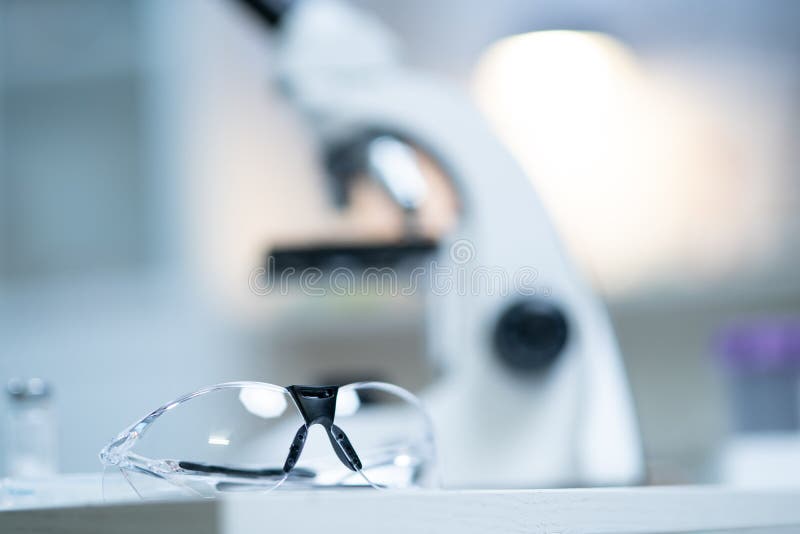 Microscope with Test Tubes on a Laboratory Bench Stock Photo - Image of ...