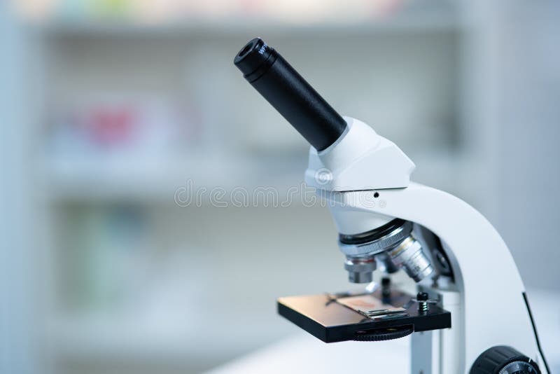 Microscope with Test Tubes on a Laboratory Bench Stock Photo - Image of ...