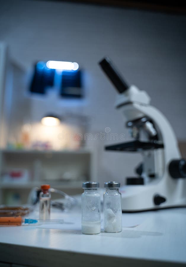 Microscope with Test Tubes on a Laboratory Bench Stock Photo - Image of ...