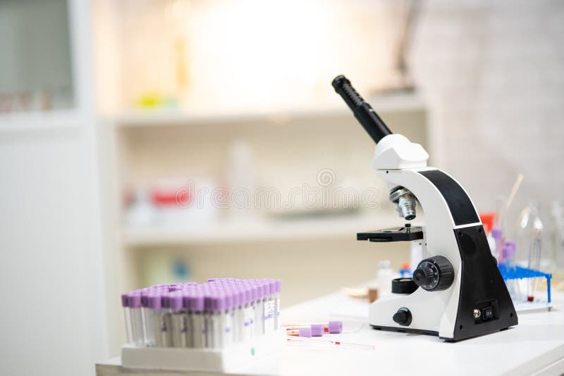 Microscope with Test Tubes on a Laboratory Bench Stock Photo - Image of ...