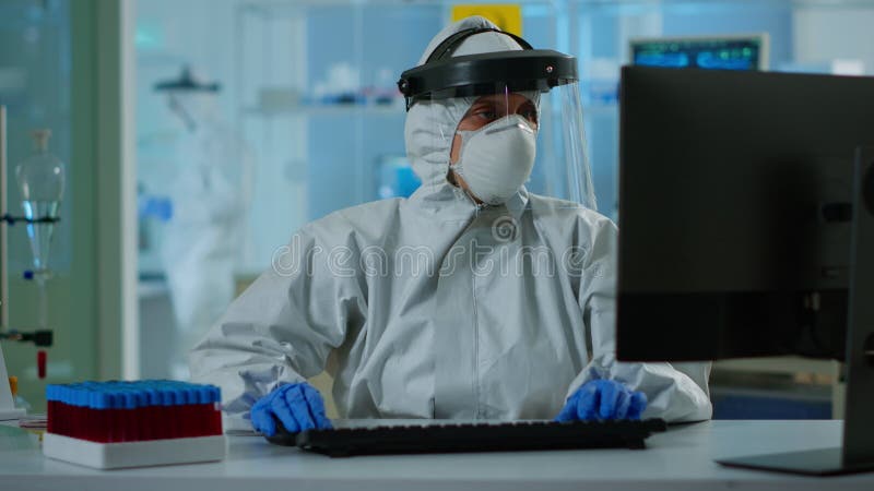 Laboratory Technician Assistant in Ppe Suit Analyzing Blood Sample ...