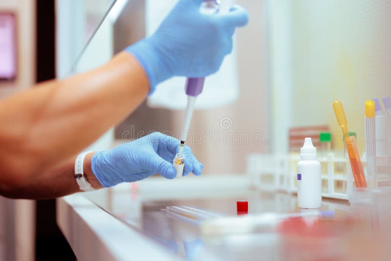 Laboratory Technician Holding a Dispenser for Medical Tests Stock Image ...