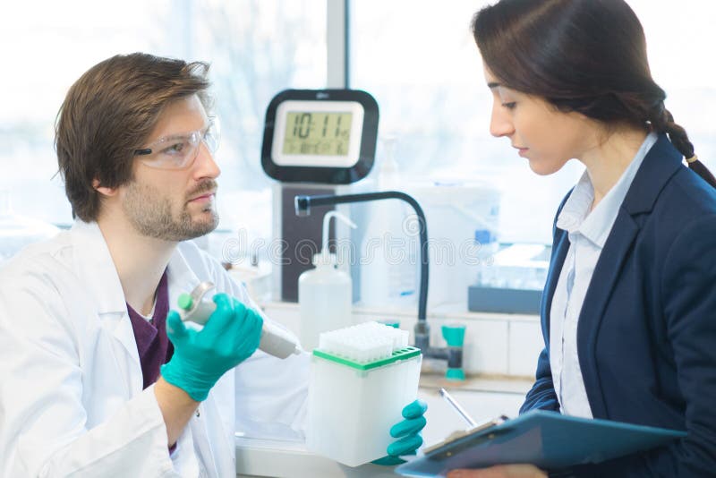 Laboratory Technician Holding Plastic Container and Pipette Stock Image ...