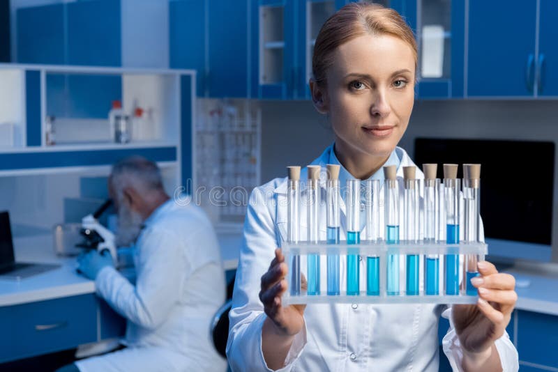 Laboratory Technician Holding Tubes and Looking at Camera Stock Photo ...