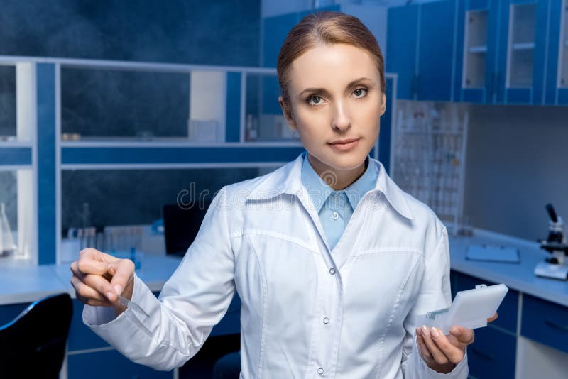 Laboratory Technician in Lab Coat Looking at Camera Stock Photo - Image ...