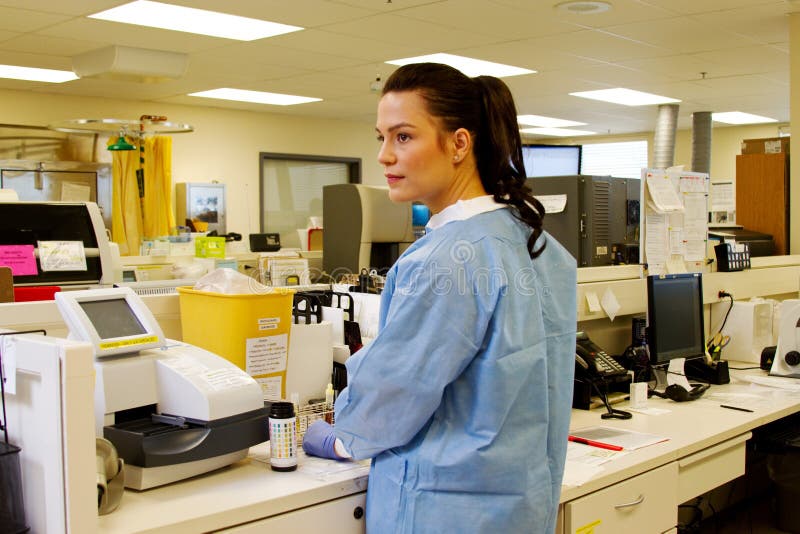 Laboratory Technician Looks Up from Work Stock Photo - Image of ...